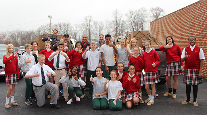 Monsignor Slade Donates Toys & Uniforms